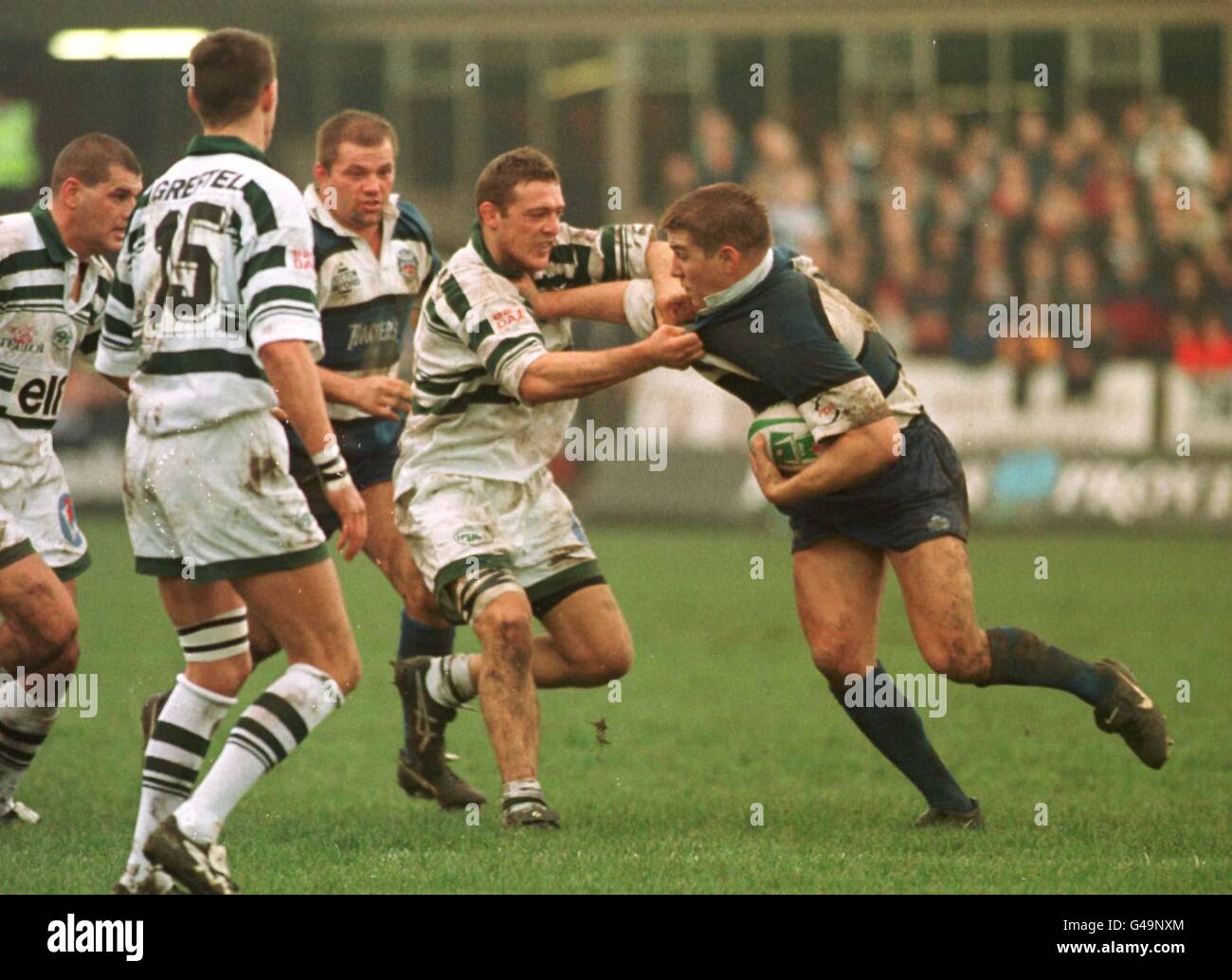 Bath's Dan Lyle (right) about to be caught by Pau players in the ...