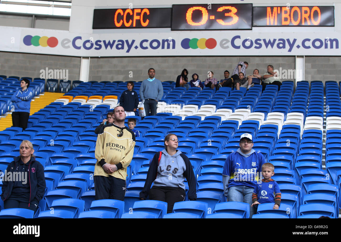 Cardiff City fans show their dejection as they sit in the stands after ...