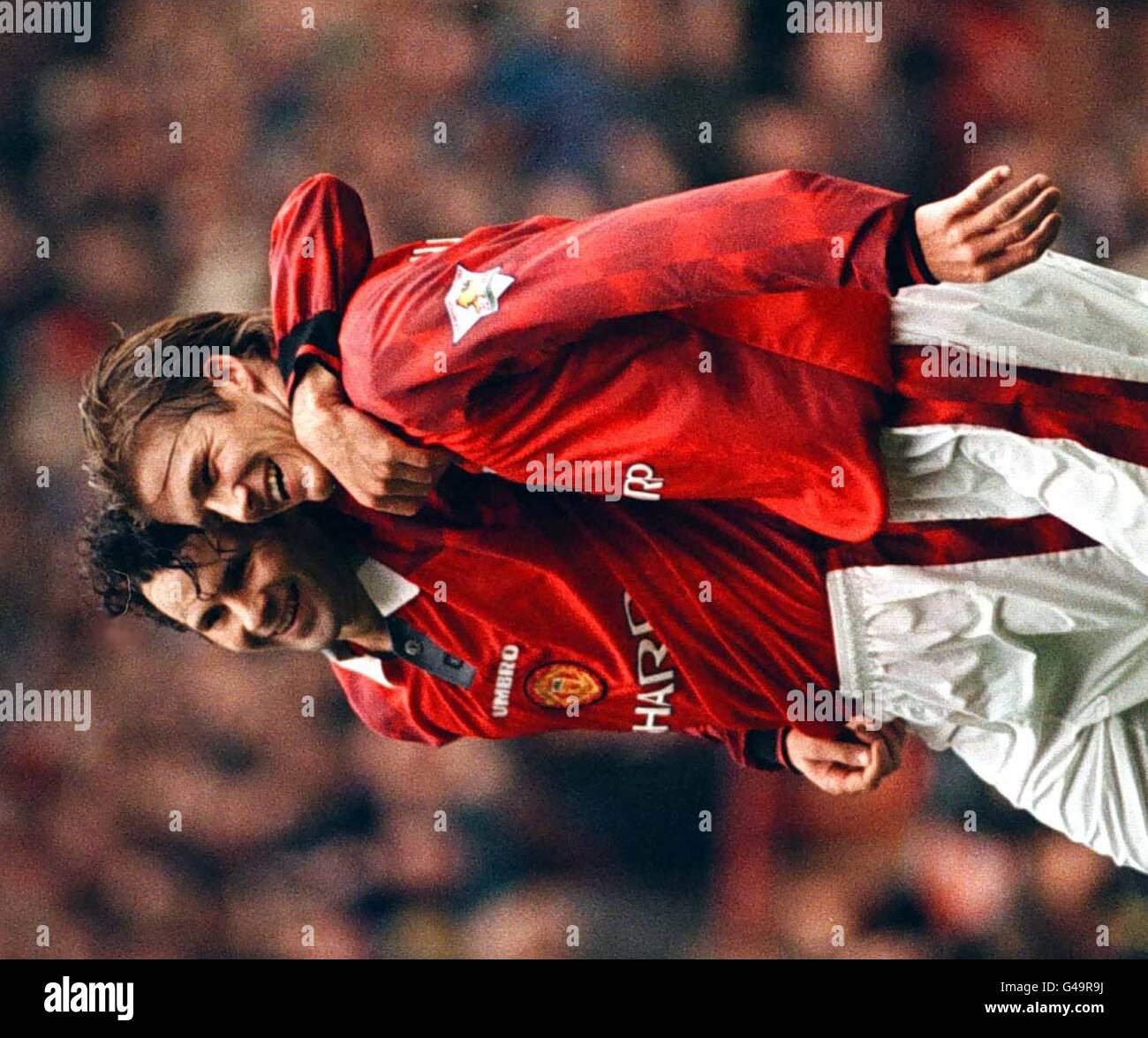 Ryan Giggs (left) celebrates with team mate David Beckham after scoring ...