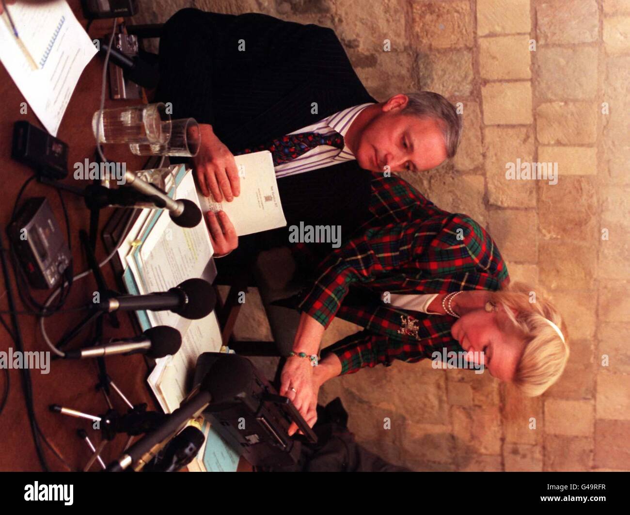 Former Tory MP Neil Hamilton sits beside his wife Christine as she ...