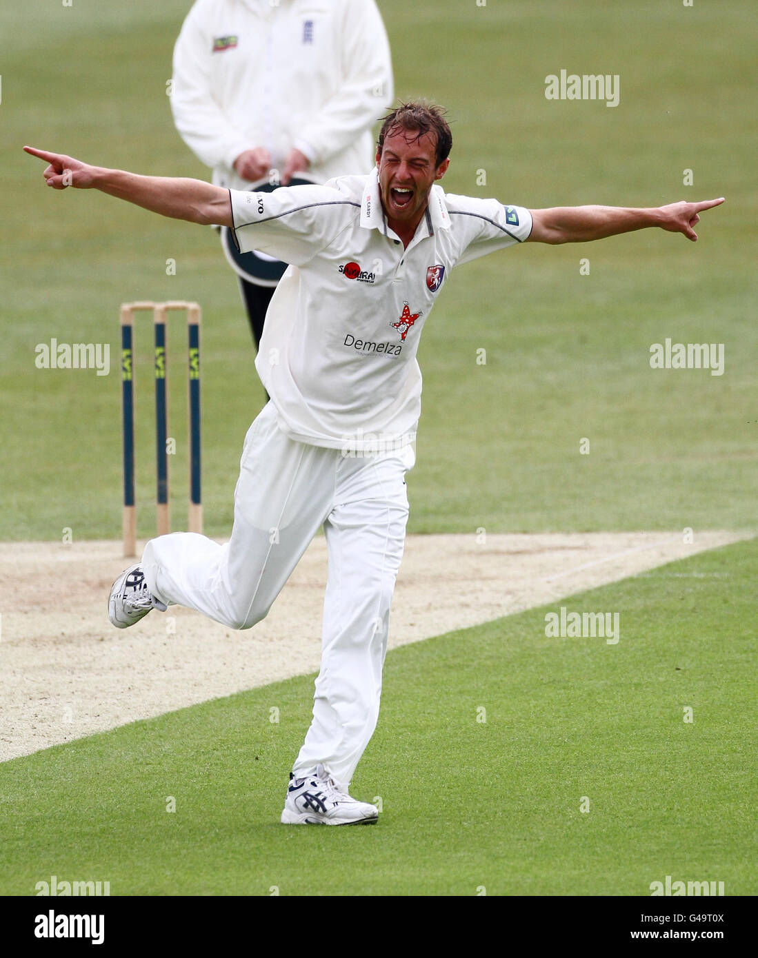 Kent bowler Neil Saker celebrates taking the wicket of Mal Loye during ...
