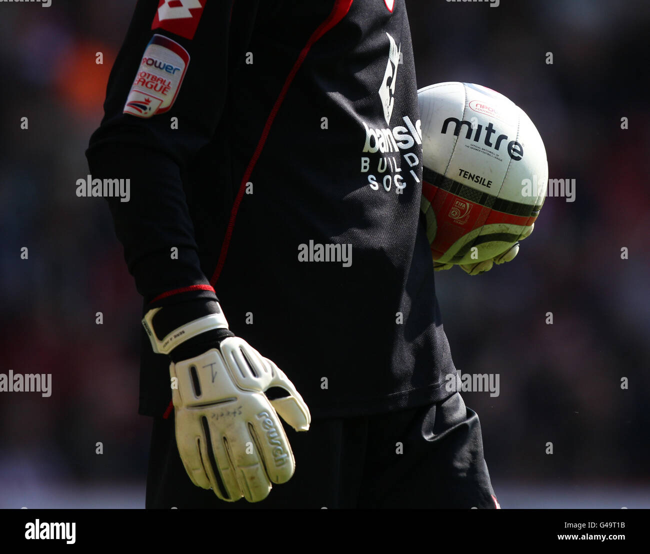 Detailed view of Barnsley goalkeeper Luke Steele holding an official ...