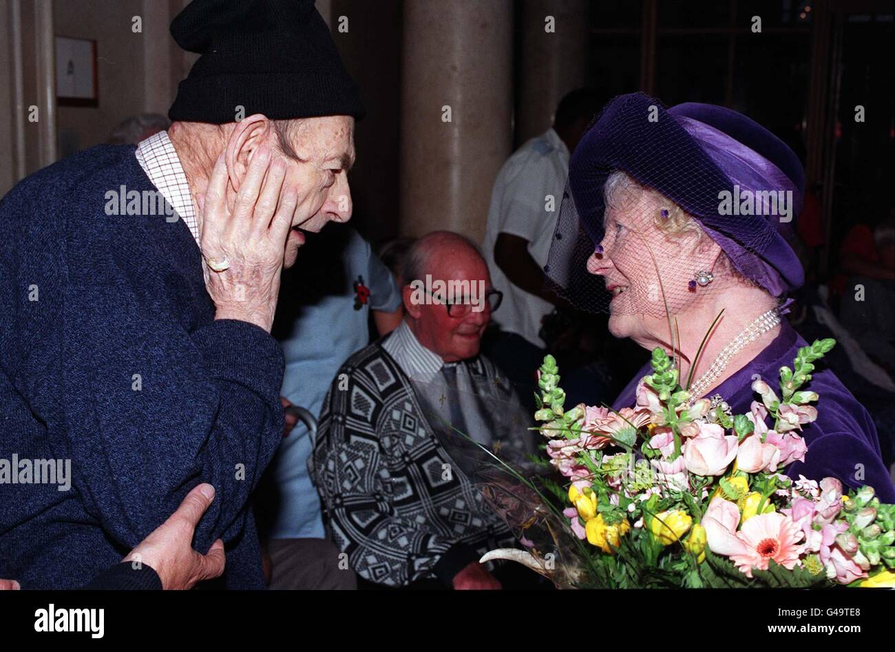 The Queen Mother talks Jack Knibbs, aged 104, during her visit to the ...