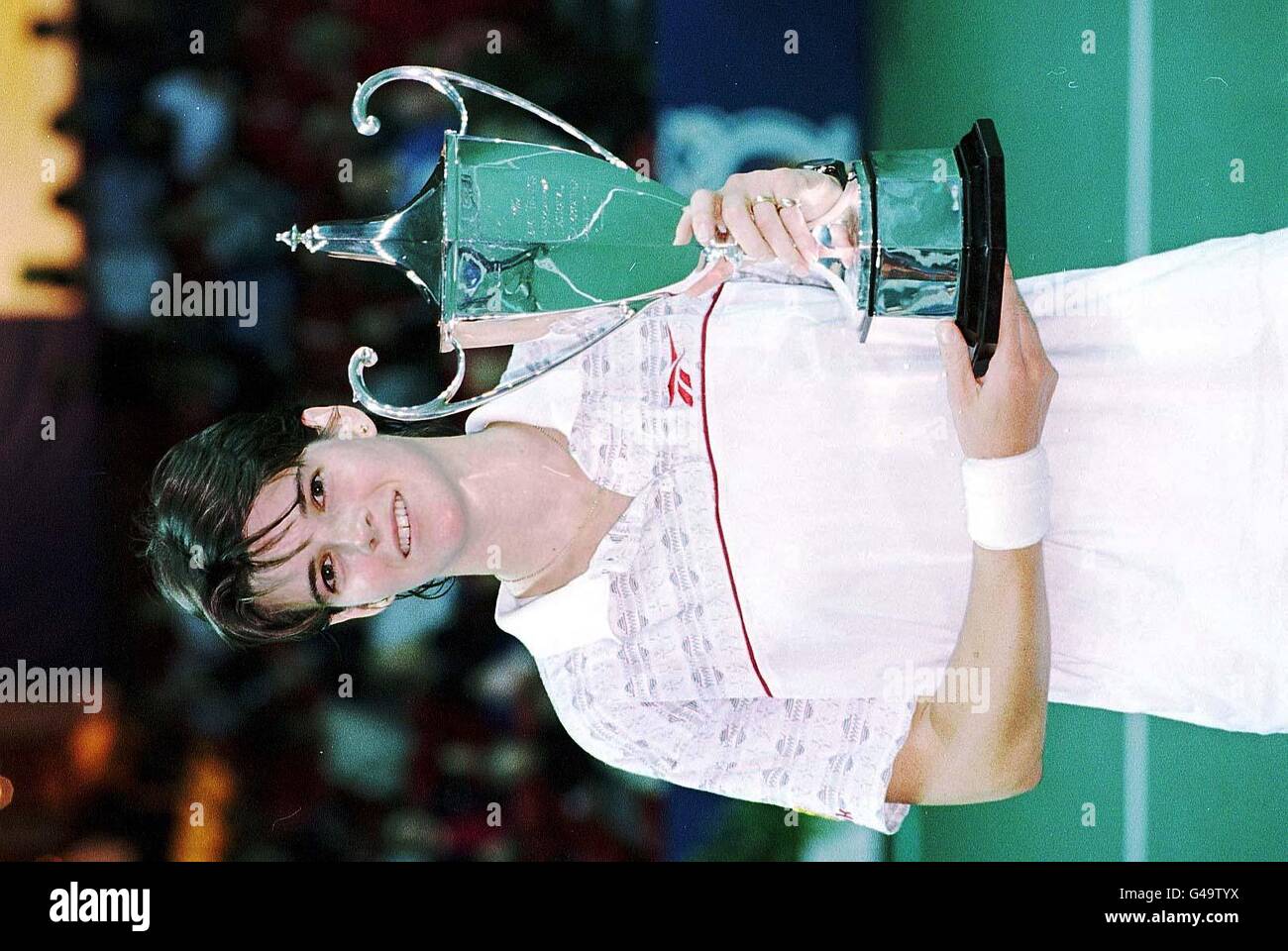 Sam Smith poses for the media with her trophy following her victory in ...