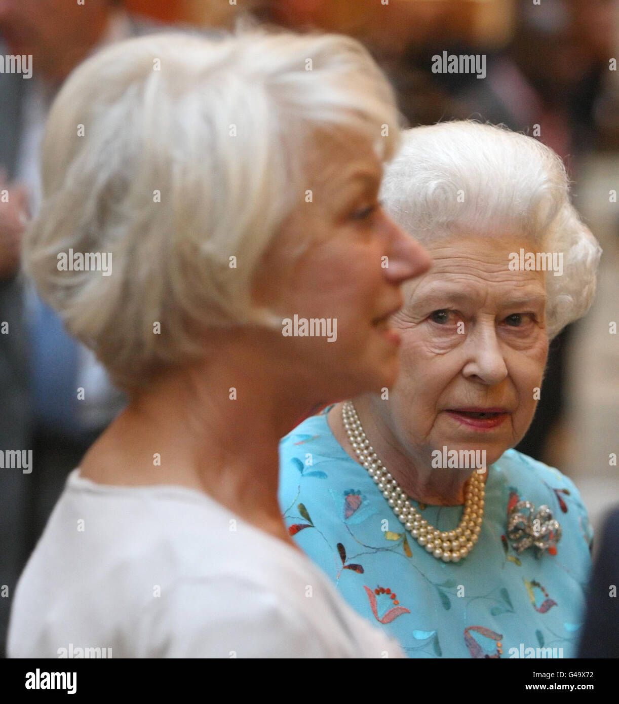 Queen Elizabeth II meets Dame Helen Mirren at a reception to celebrate ...