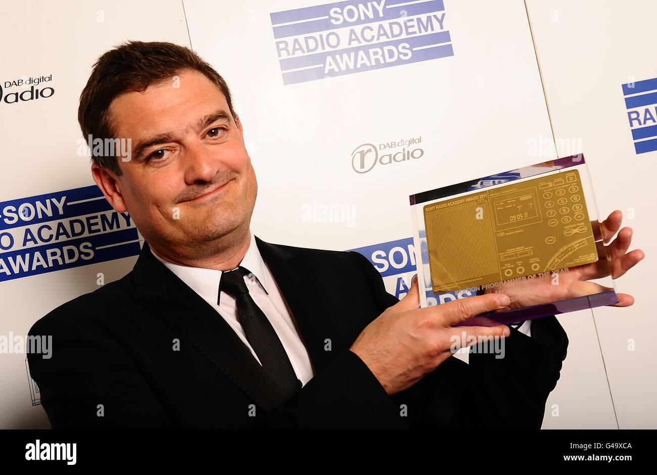 Moz Dee with the award for Station Programmer, at the Sony Radio ...