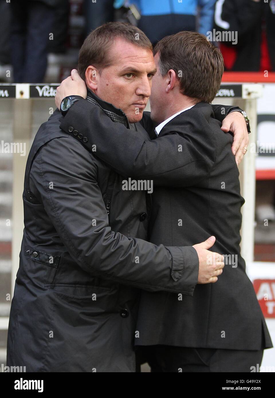 Football half length mid hug datacoapplies hi-res stock photography and ...