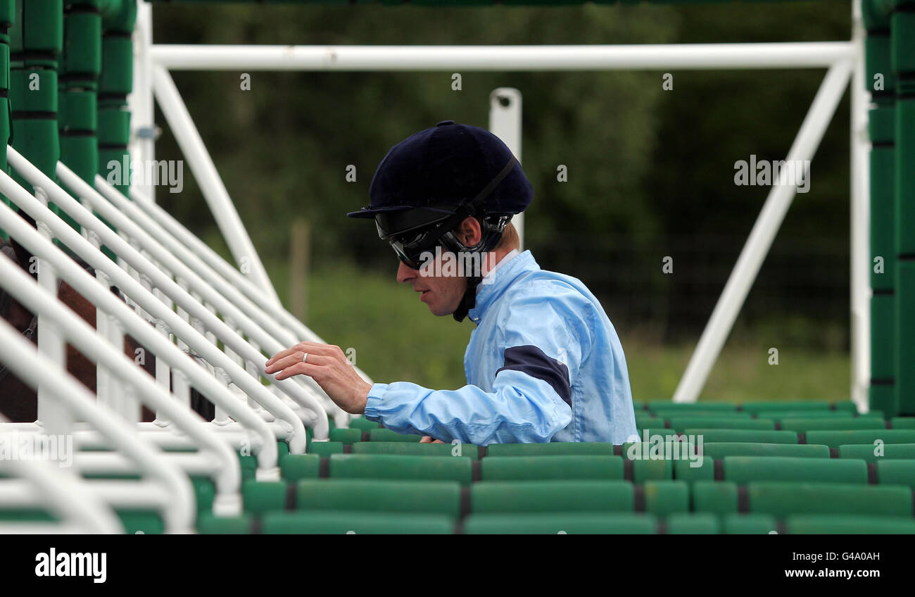 Jockey Richard Hughes lines up in the starting stalls during the Scope ...