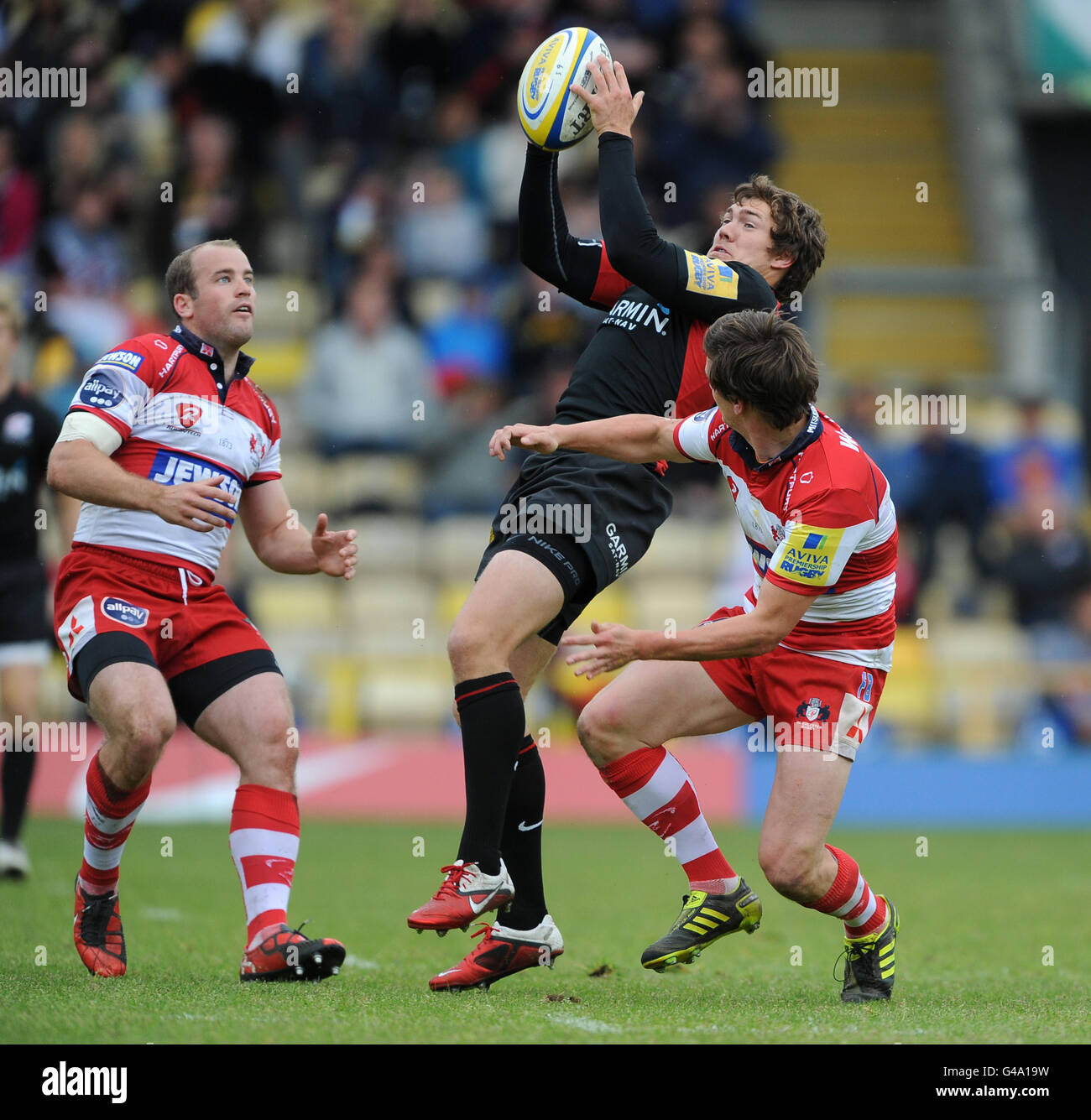 Saracens' Alex Goode takes the high ball under pressure from Gloucester ...