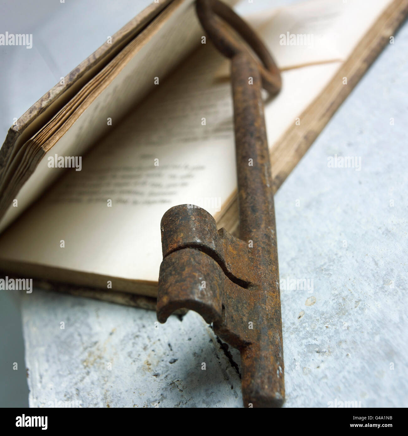 Old key and book Stock Photo - Alamy