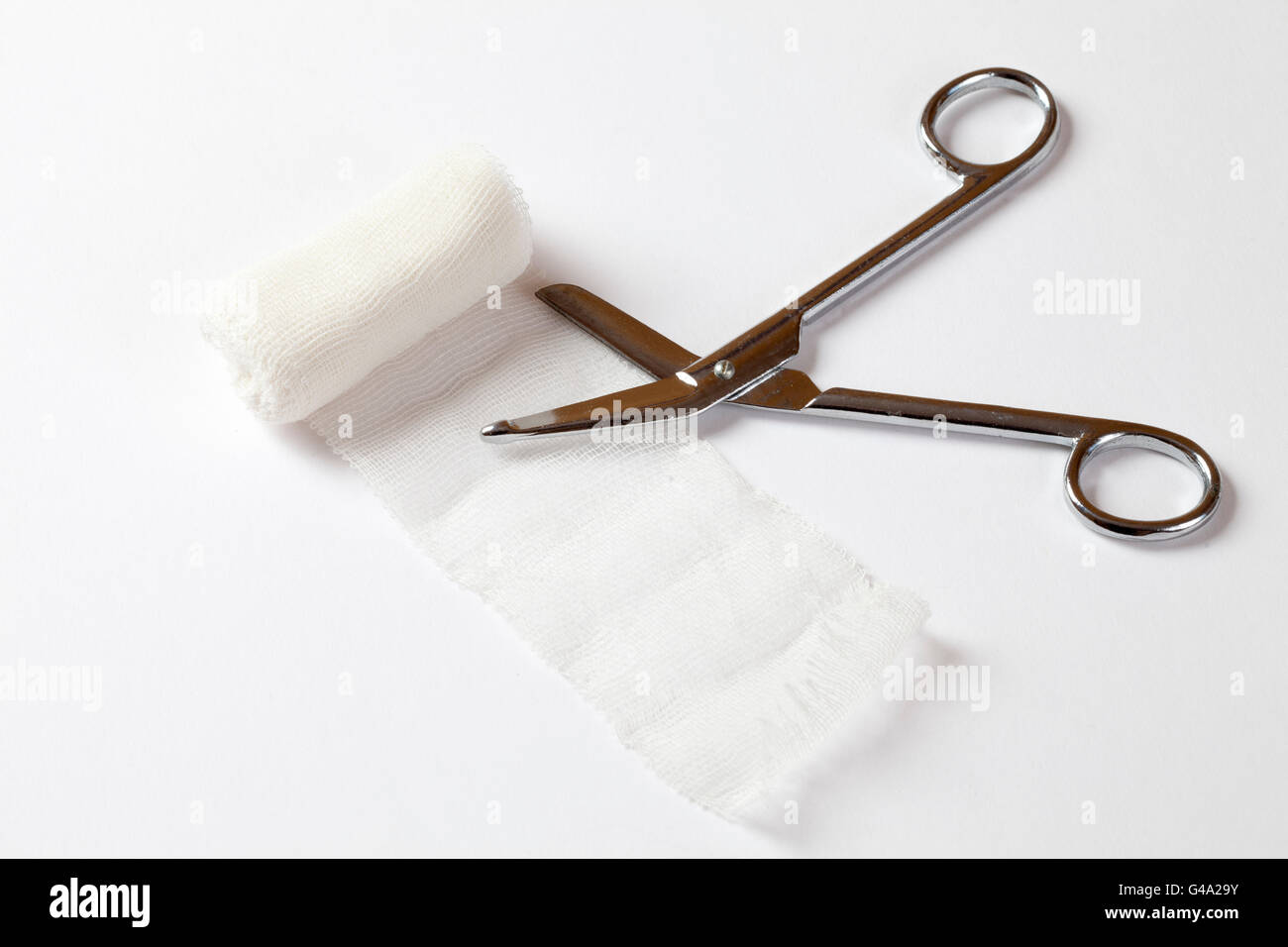 Gauze bandage and bandage scissors Stock Photo - Alamy