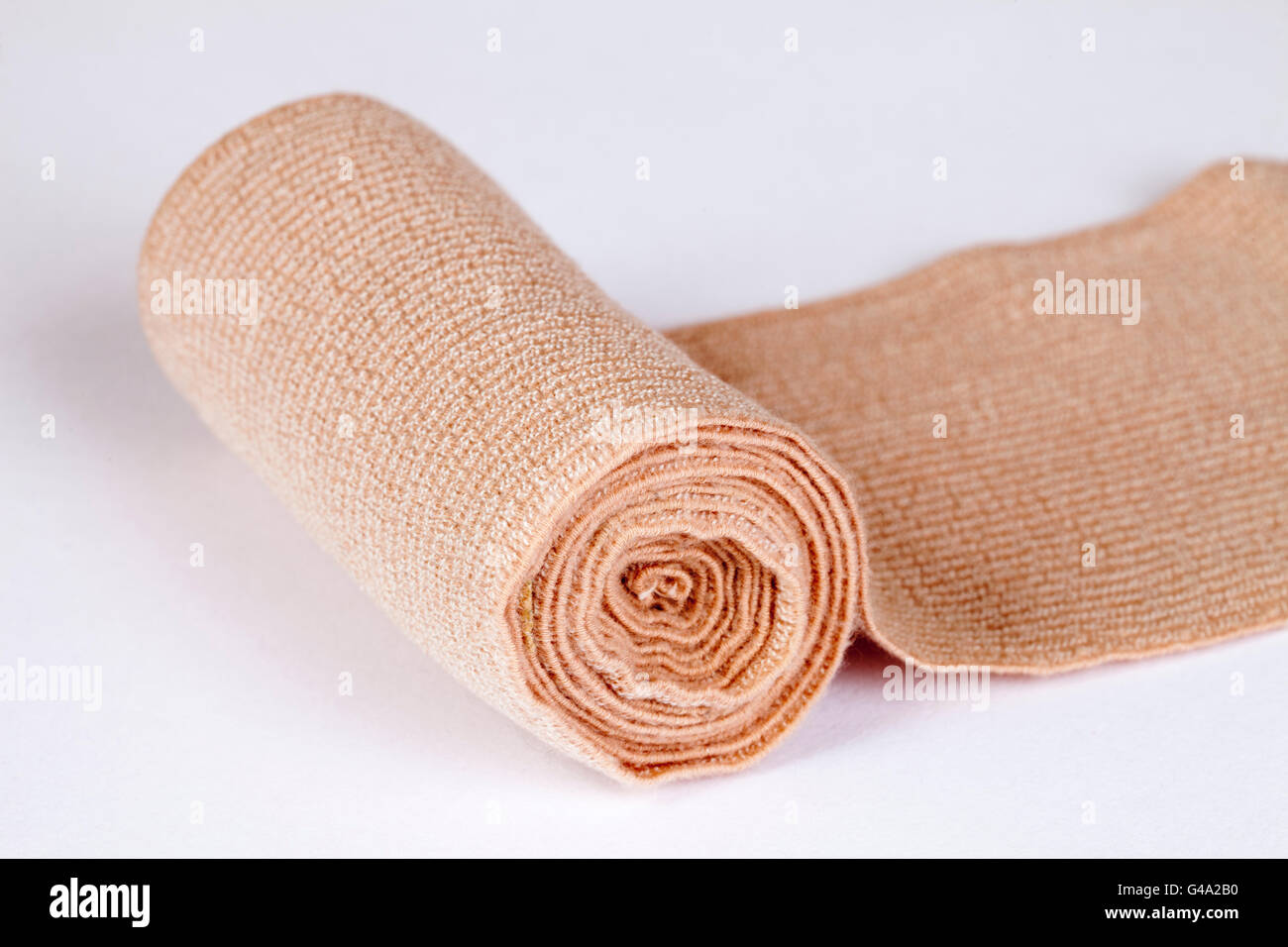 Elastic bandage, rolled up Stock Photo - Alamy