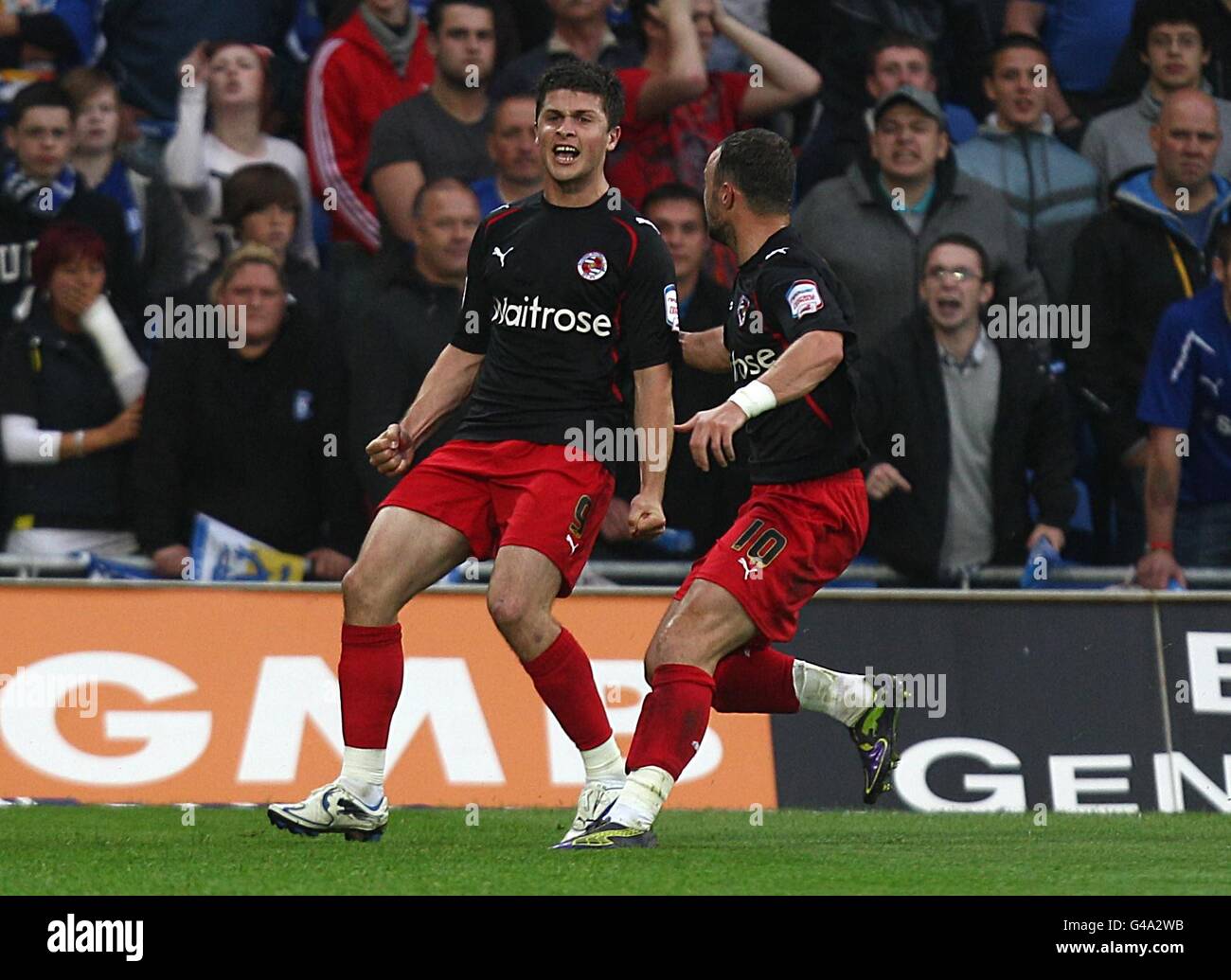 Reading's Shane Long (left) celebrates after he scores his and his side ...