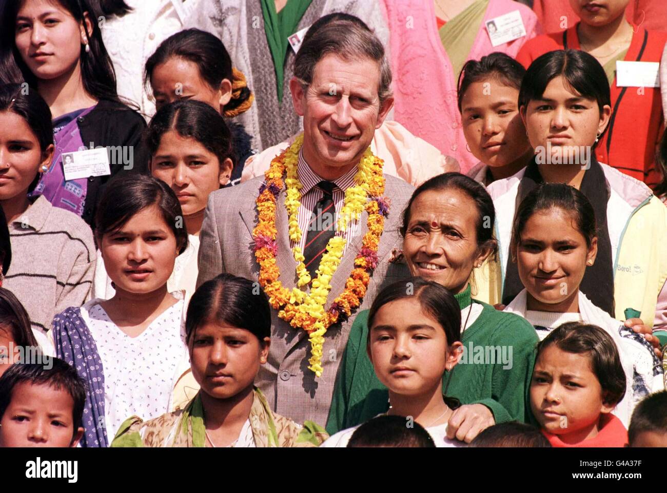 The Prince of Wales stands with girl's from the Maiti Nepal Refuge Home ...
