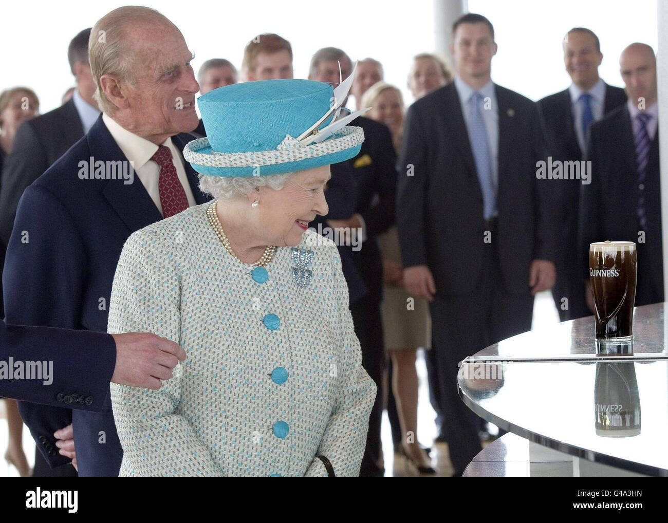 Queen Elizabeth II and the Duke of Edinburgh admire a pint of Guinness ...