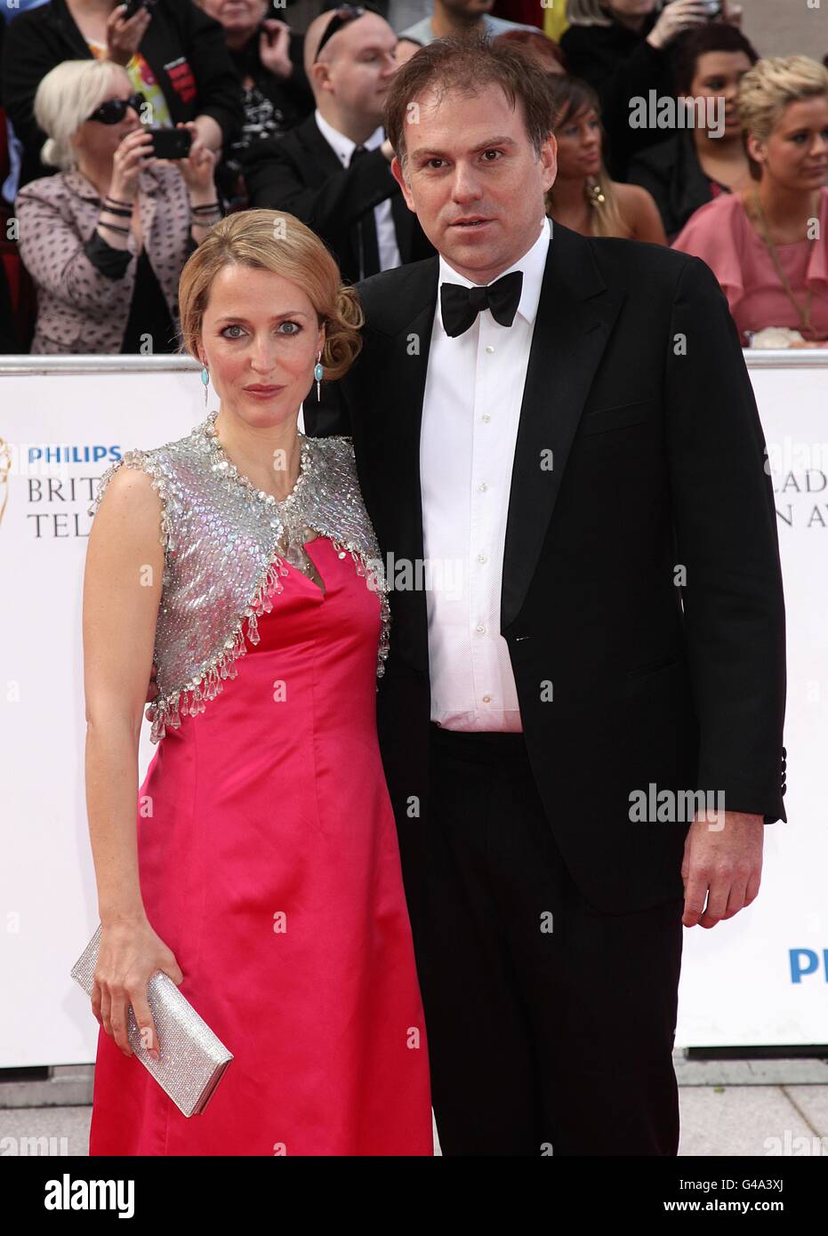 Gillian Anderson and husband Mark Griffiths arriving for the Philips ...