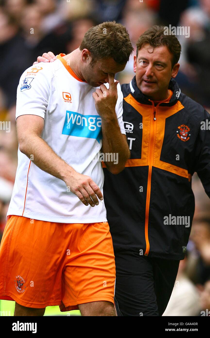Blackpool assistant manager Steve Thompson consoles Ian Evatt (left ...