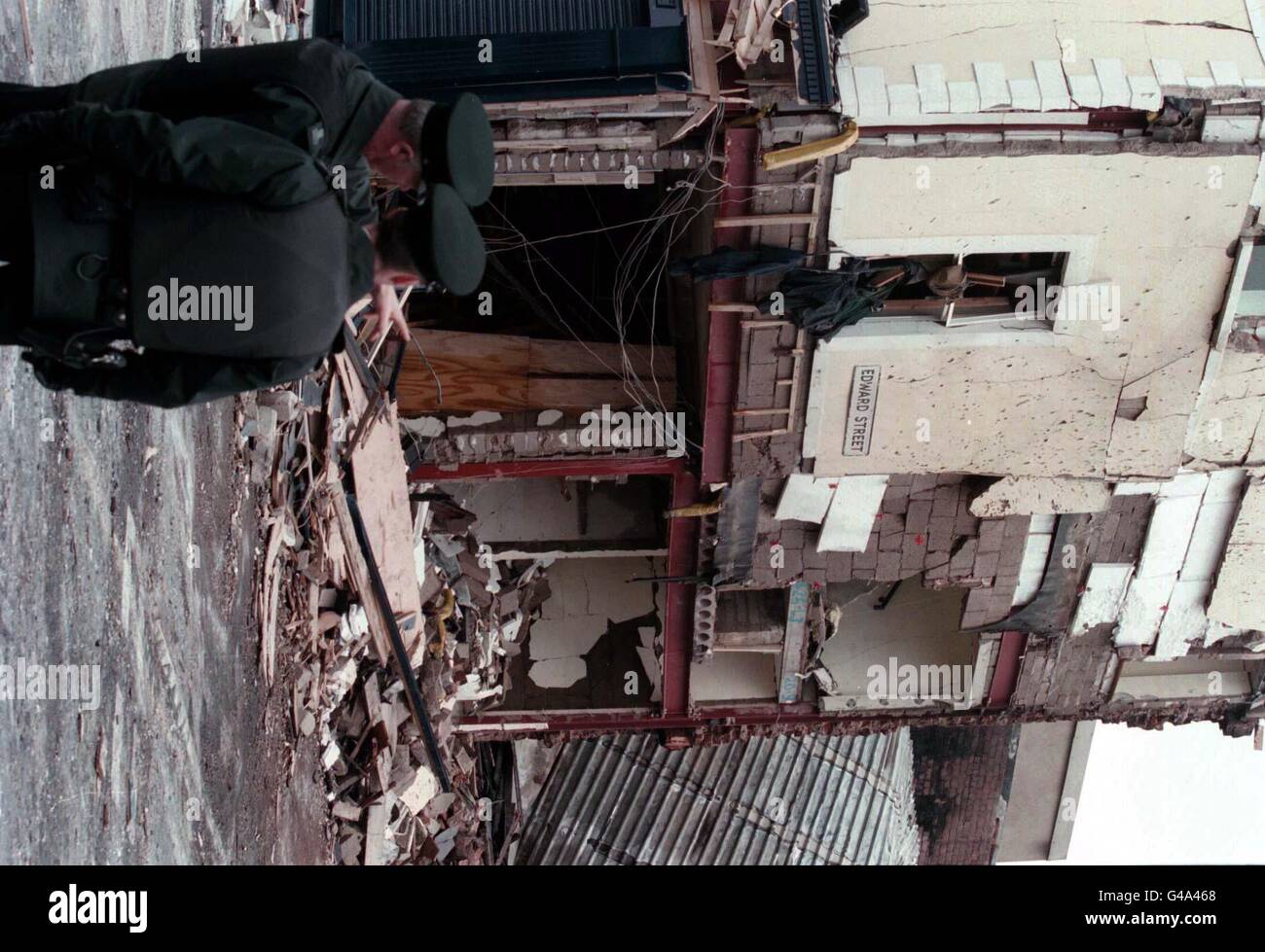 RUC officers in Portadown today (Tuesday) survey the severely damaged ...