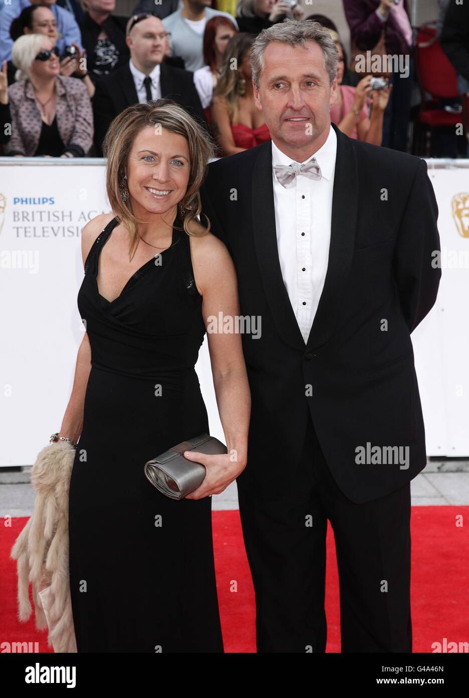 Mark Austin and guest arriving for the Philips British Academy ...