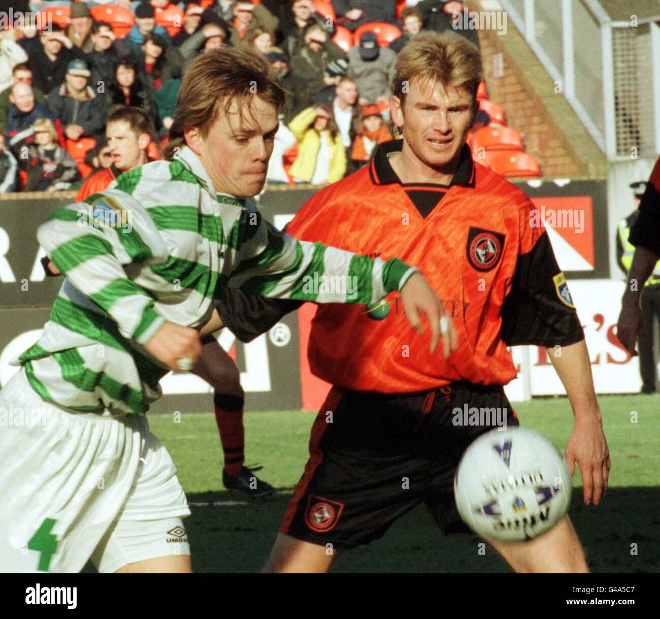 Celtic's Simon Donnelly (left) takes the ball off Erik Pedersen of ...