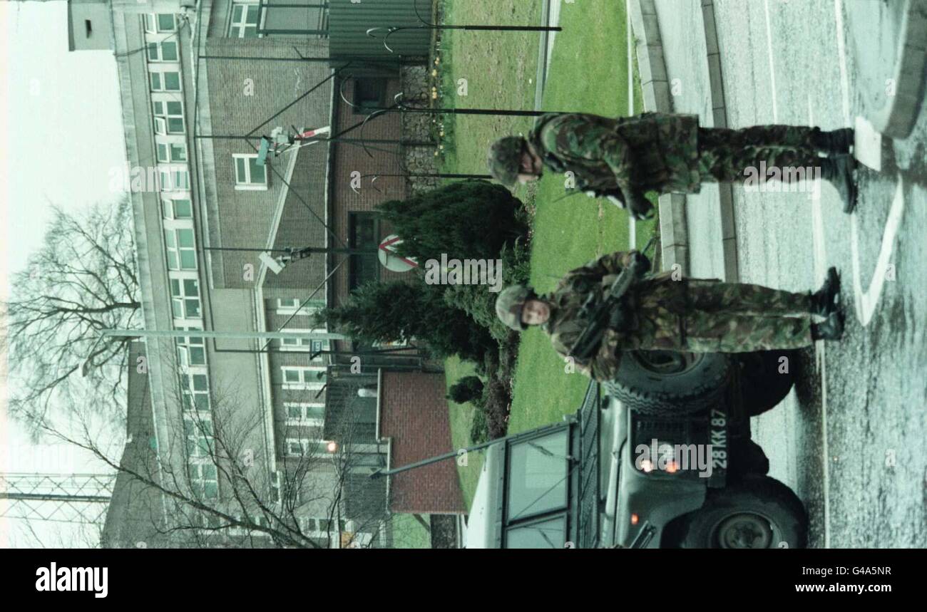 Security forces outside the Armagh RUC Station following a mortar bomb ...