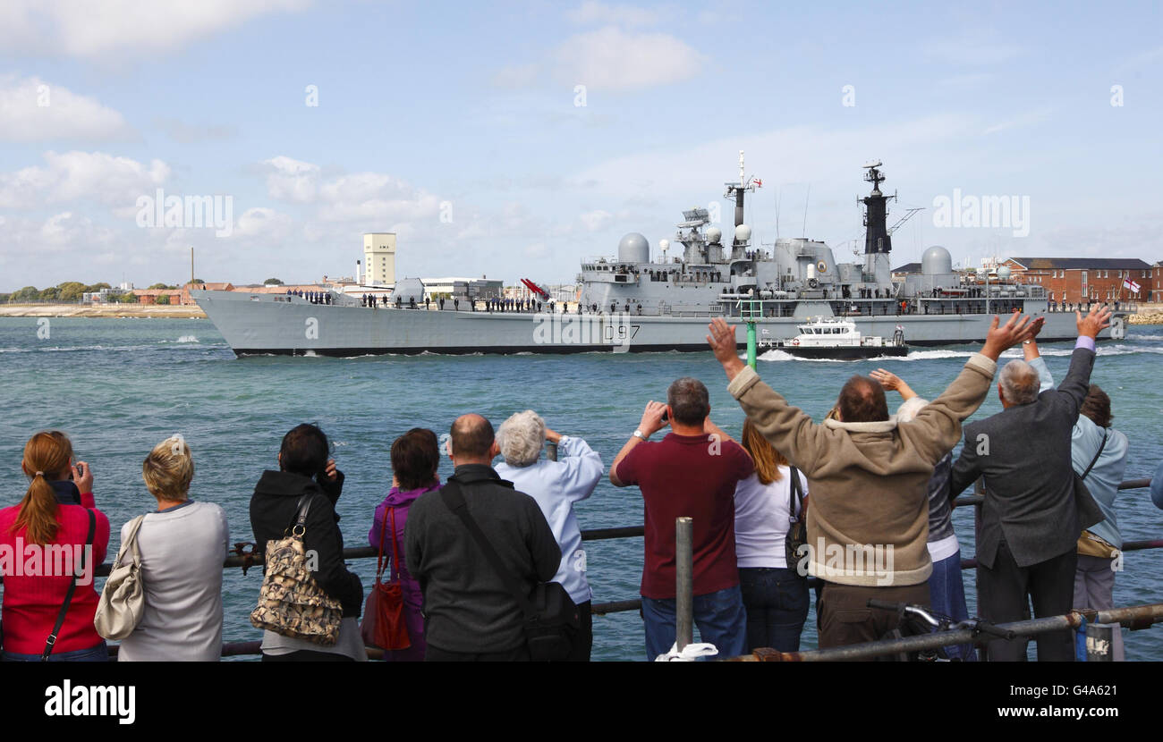 Friends and family of the crew wave to HMS Edinburgh as she leaves ...