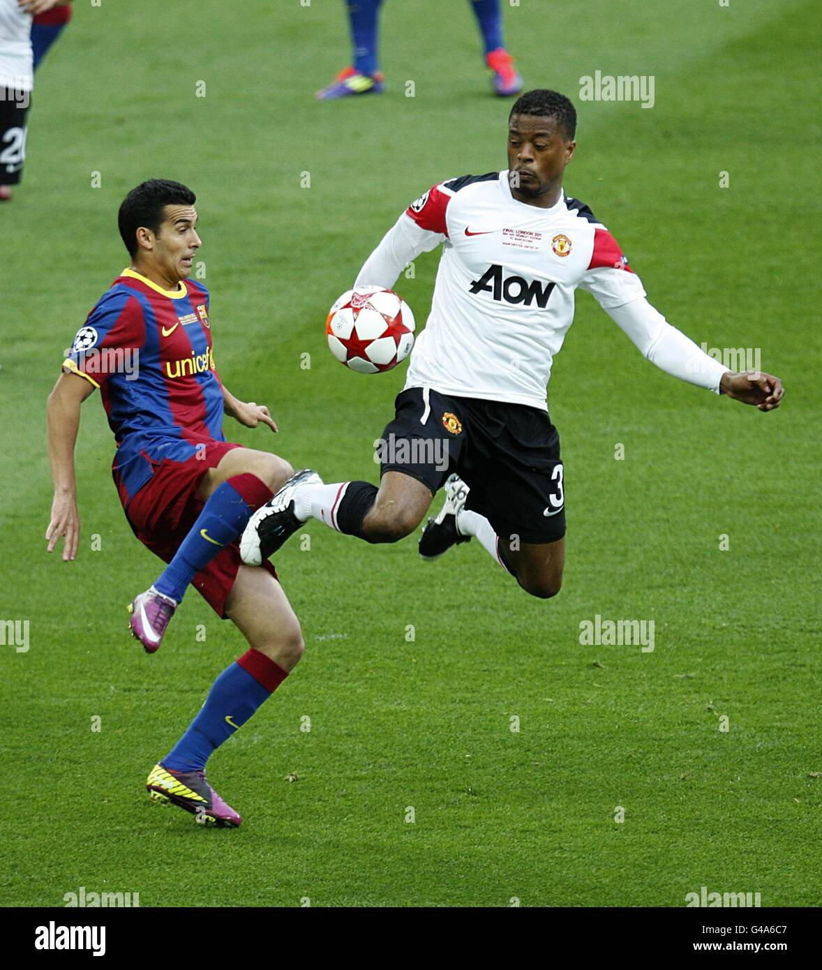 Manchester United's Patrice Evra (right) and Barcelona's Rodriguez ...