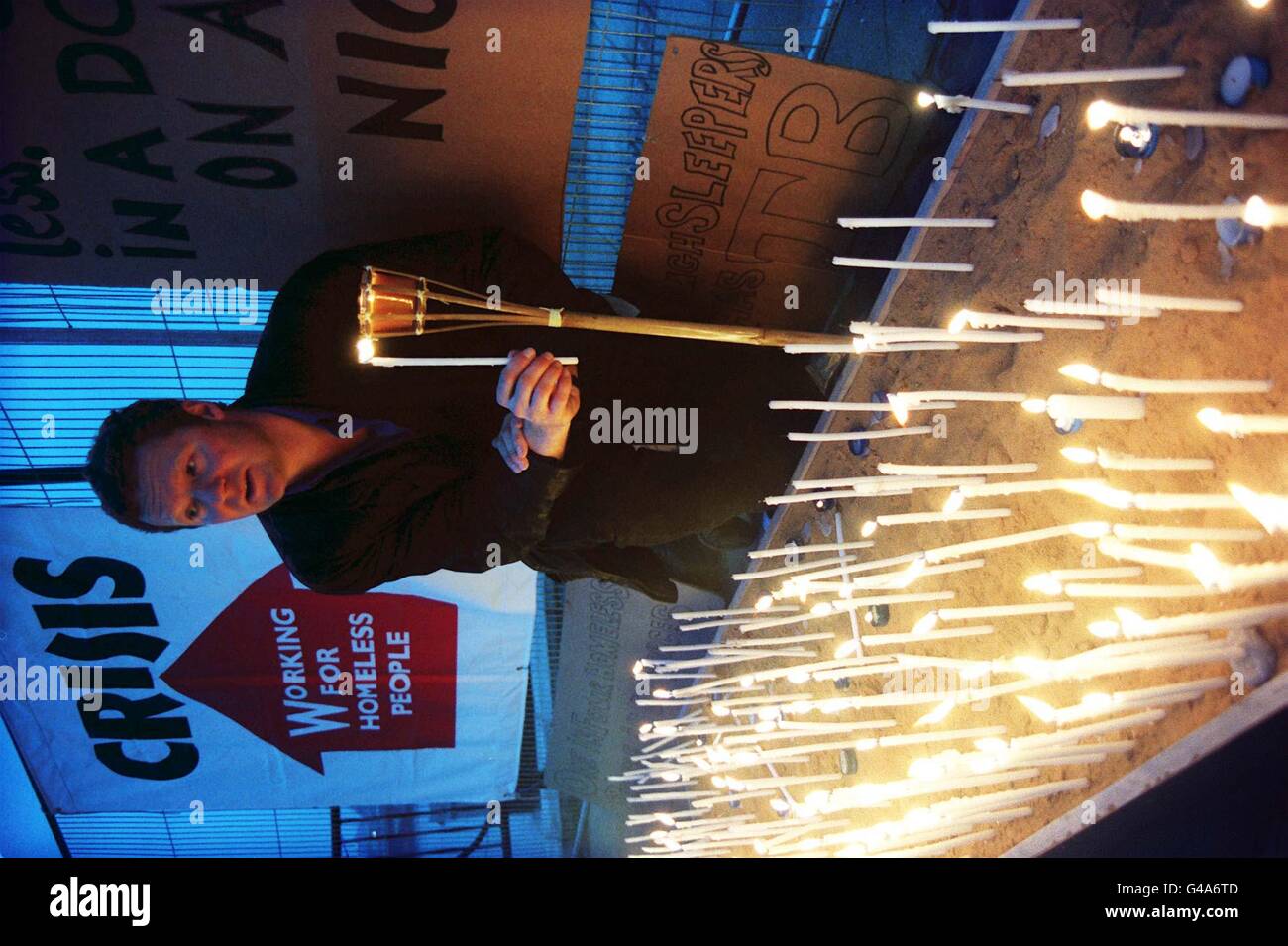 Comedian Rory Bremner lights a candle outside the Globe Theatre in ...