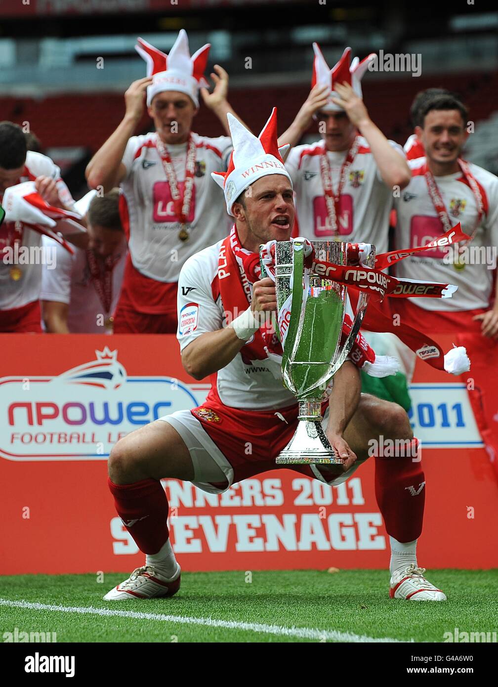 Stevenage's Chris Beardsley celebrates with the trophy after winning ...