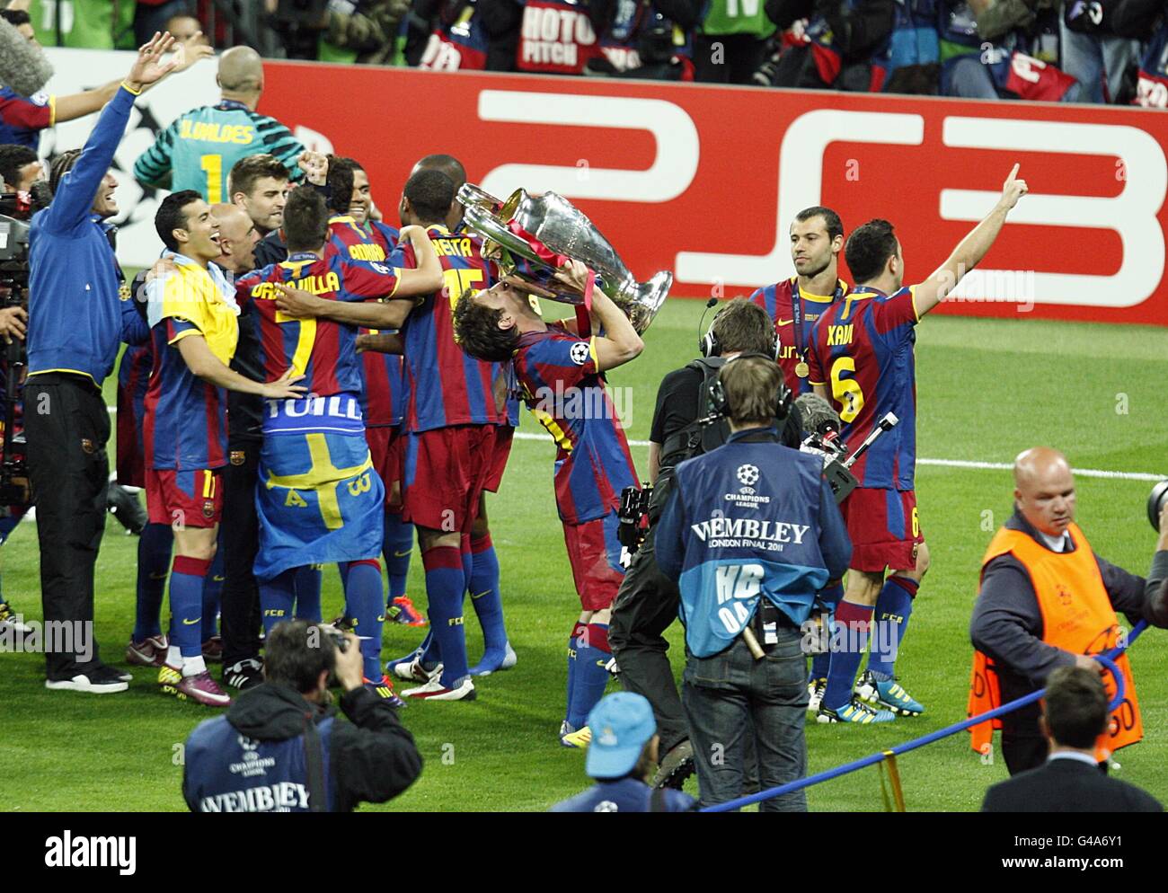 Barcelona's Lionel Messi celebrates kissing the Champions League trophy ...