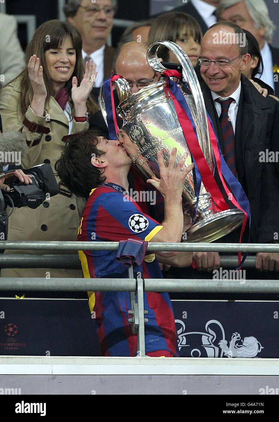 Barcelonas lionel messi celebrates kissing the champions league trophy ...