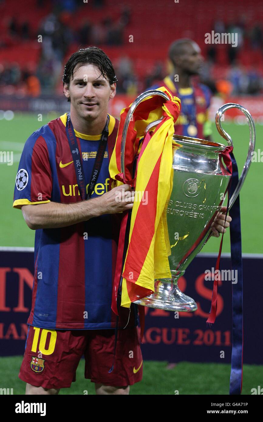 Barcelona's Lionel Messi celebrates with the trophy after the final ...