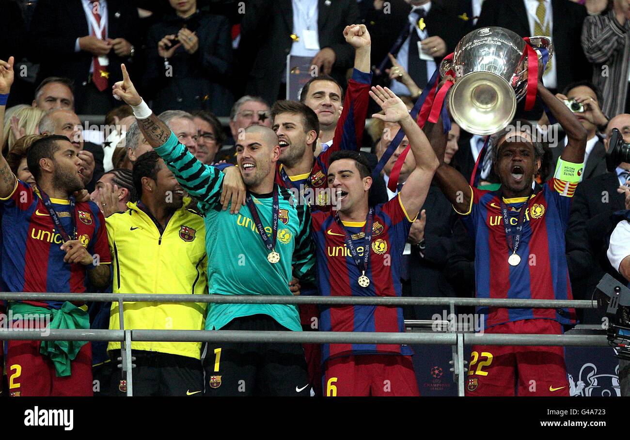 Barcelona players celebrate with the uefa champions league trophy hi ...