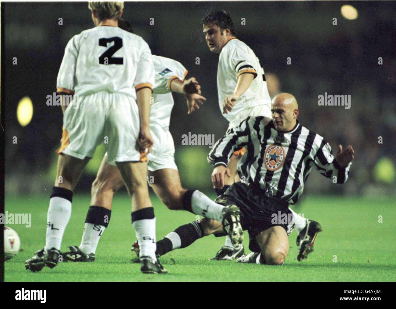 Newcastle's Temuri Ketsbaia is mobbed by Hull's Warren Joyce and Matt ...