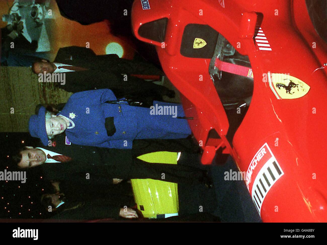 Britain's Queen Elizabeth II walks past German Formula 1 driver Michael ...