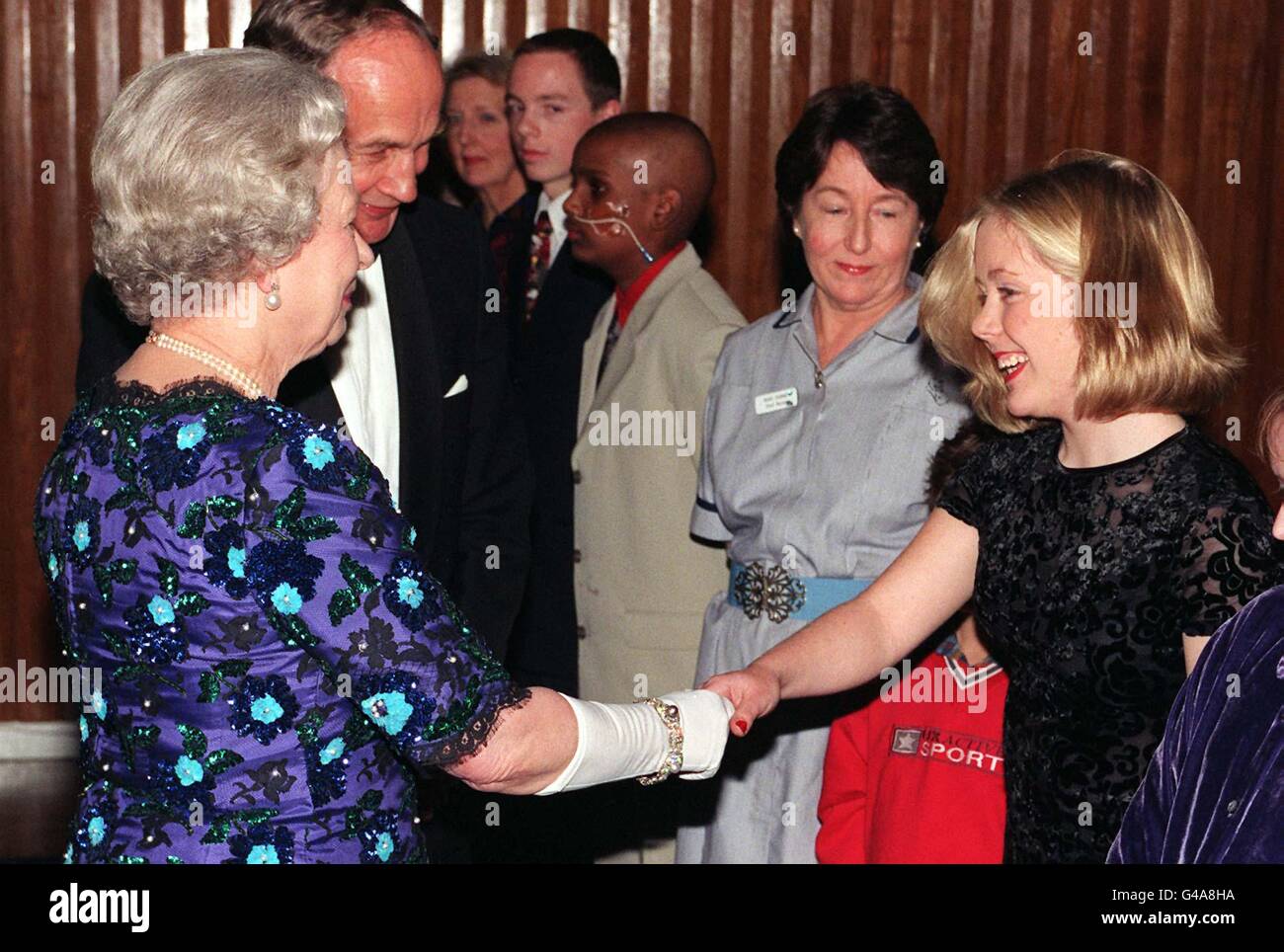 Shakes hands with sixteen year old emma may hi-res stock photography ...