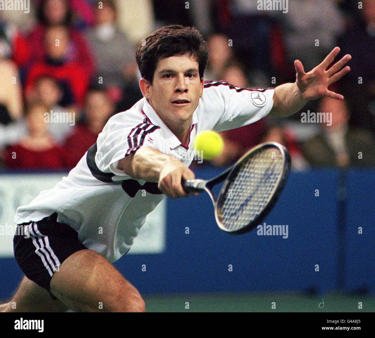Tim Henman starts the defence of his National Tennis title with a two ...