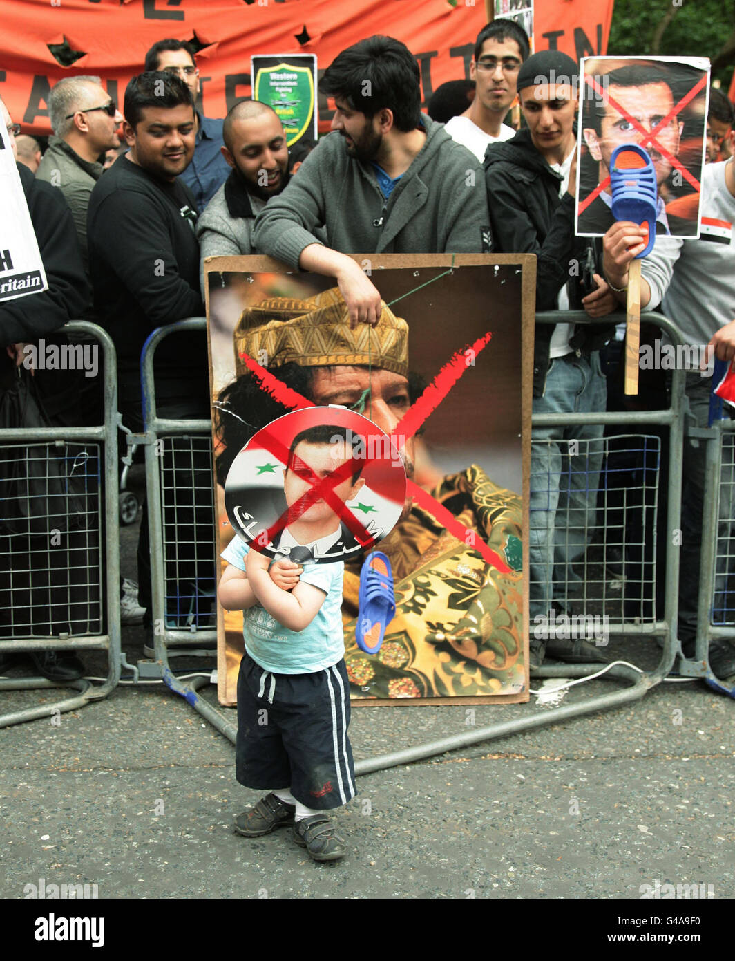 Muslims from across the UK demonstrate outside the Syrian embassy in ...