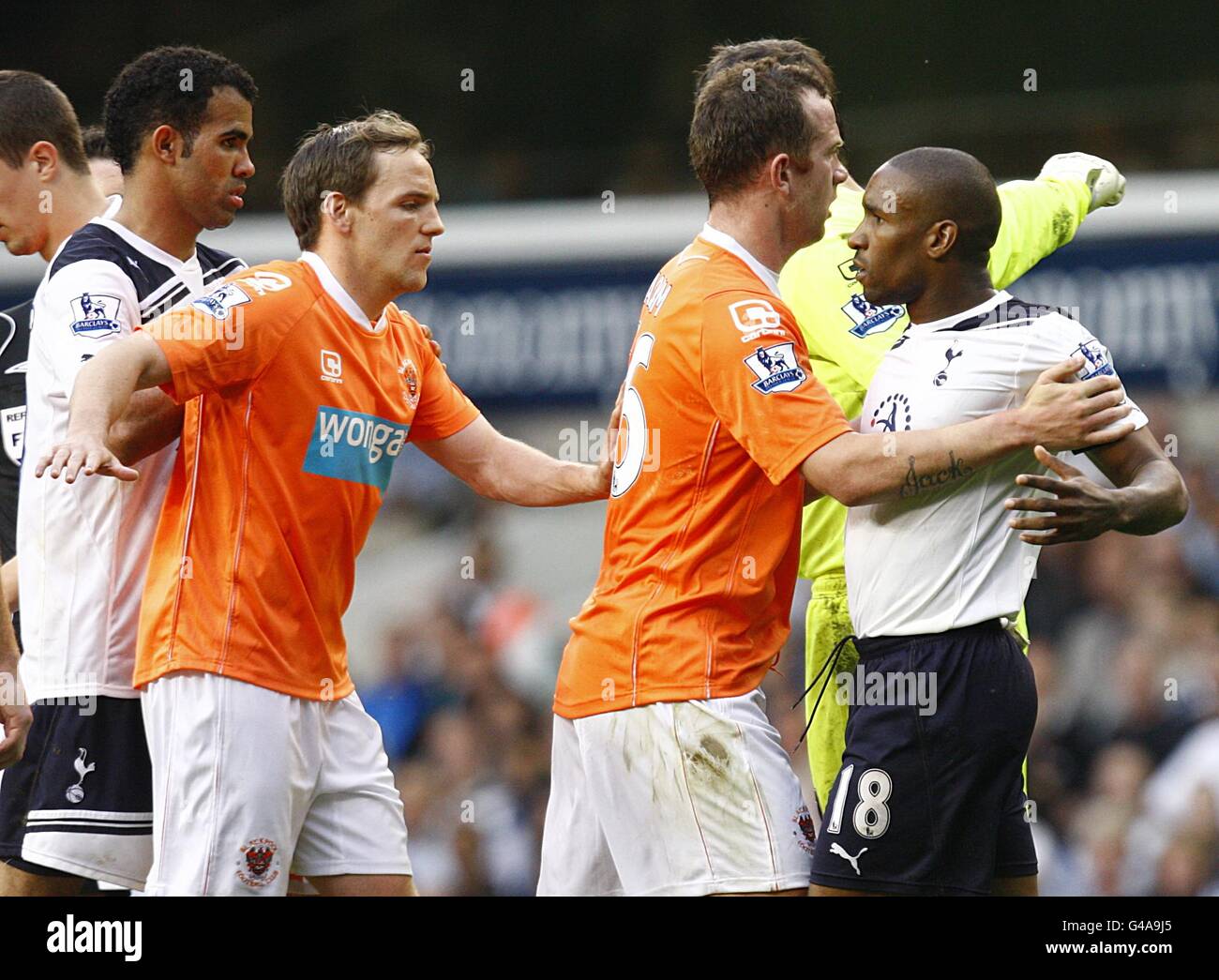 Tempers flare between Blackpool's David Vaughan (left) and Tottenham ...