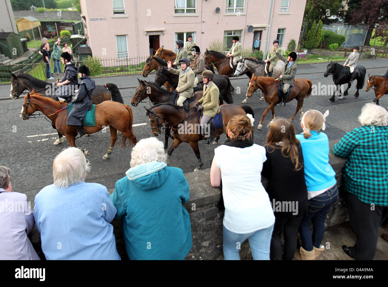 Horses and their riders go through the streets of Hawick on the first ...