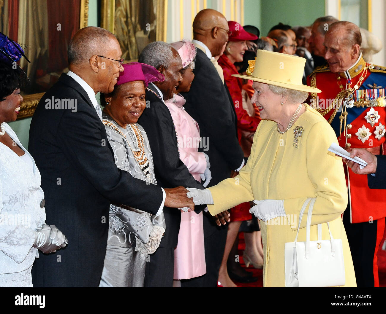 Governor The Bahamas, Sir Arthur Foulkes shakes hands with Queen ...