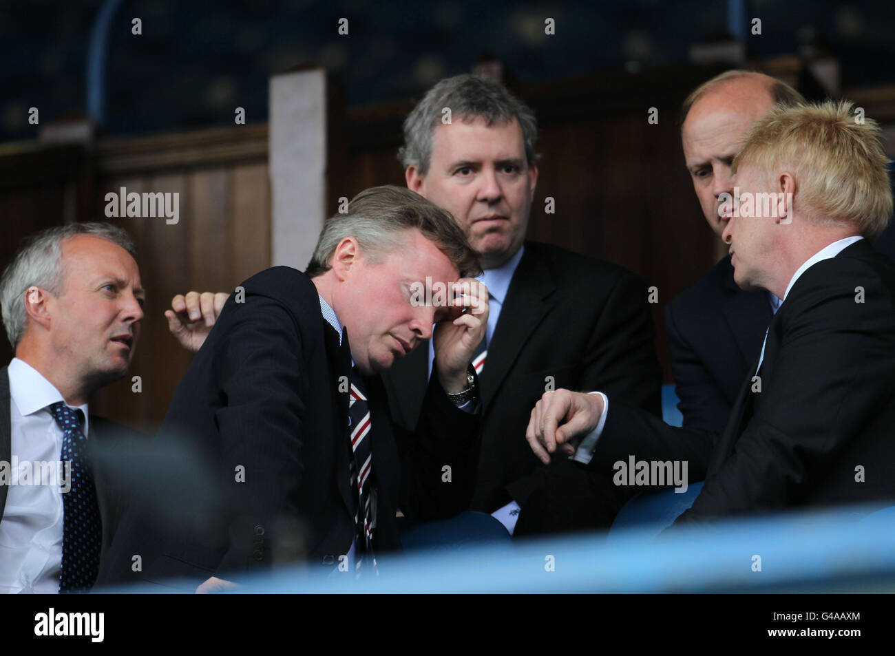 Rangers' new owner Craig Whyte talks to Donald Muir in the Directors ...