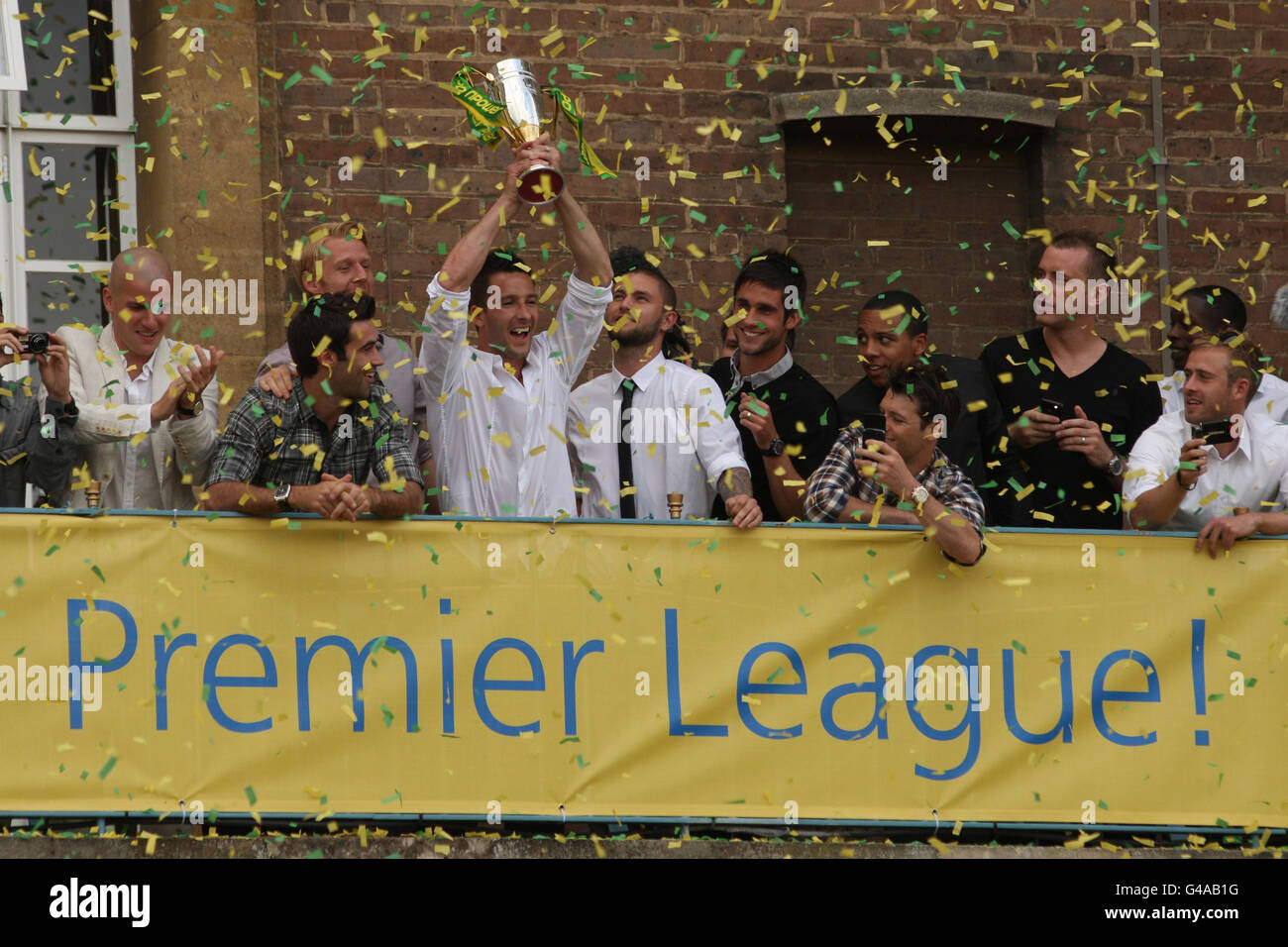 Norwich City's Adam Drury lifts the npower Football League Promotion ...