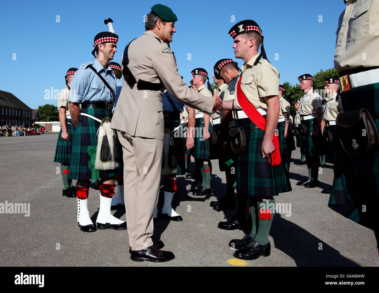 Brigadier Simon Wolsey presents service medals to soldiers of the ...