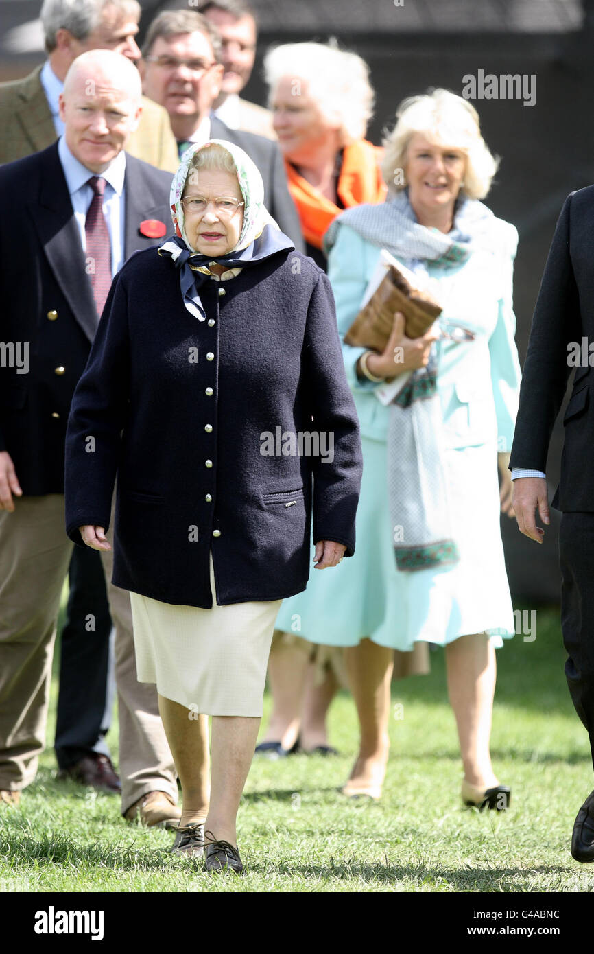 Queen Elizabeth II and the Duchess of Cornwall looks at trade stands as ...
