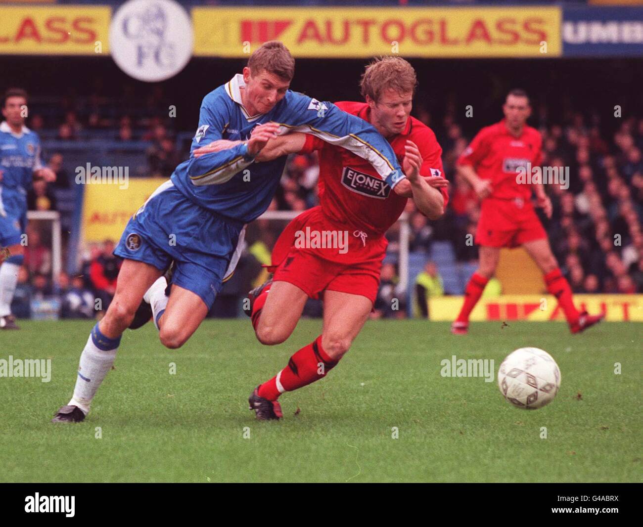 Chelsea's Tore Andre Flo and Wimbledon's Ben Thatcher (right) battle ...