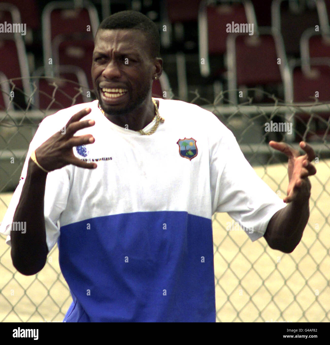 West Indian fast bowler Curtly Ambrose keeps an eye on the opposition ...