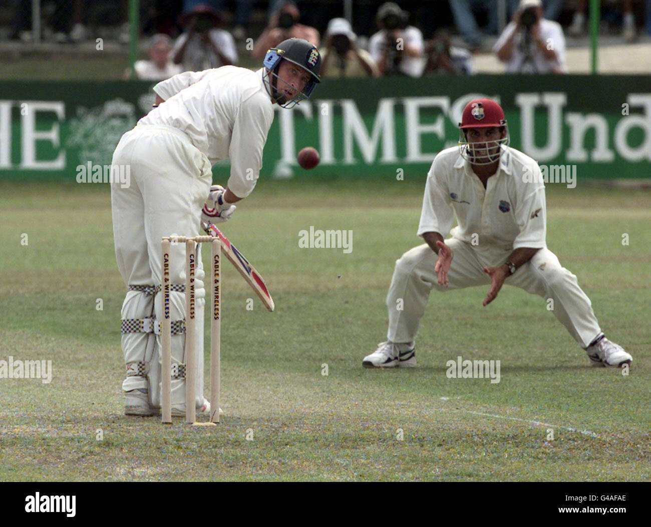 England's Nasser Hussain (left) and West Indies Jimmy Adams watch the ...