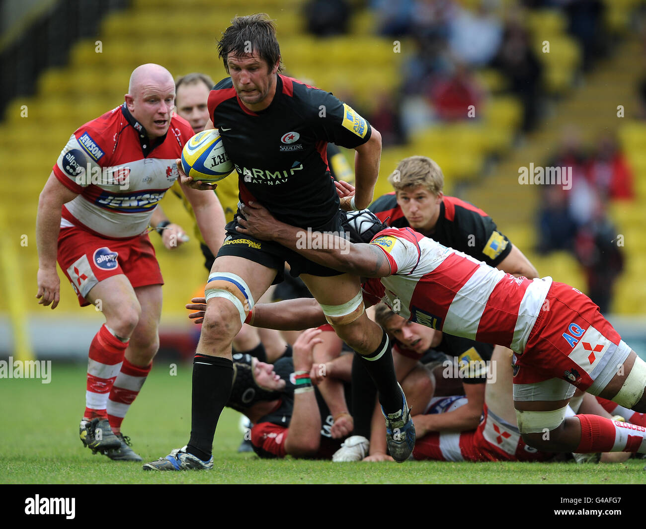 Saracens' Ernst Joubert (centre) breaks through the Gloucester Rugby ...