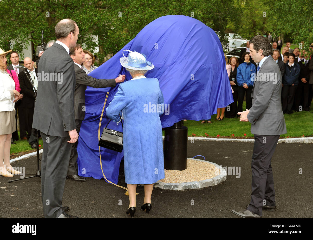 Queen Elizabeth II unveils the statue 'Sea of Stars' during a visit to ...